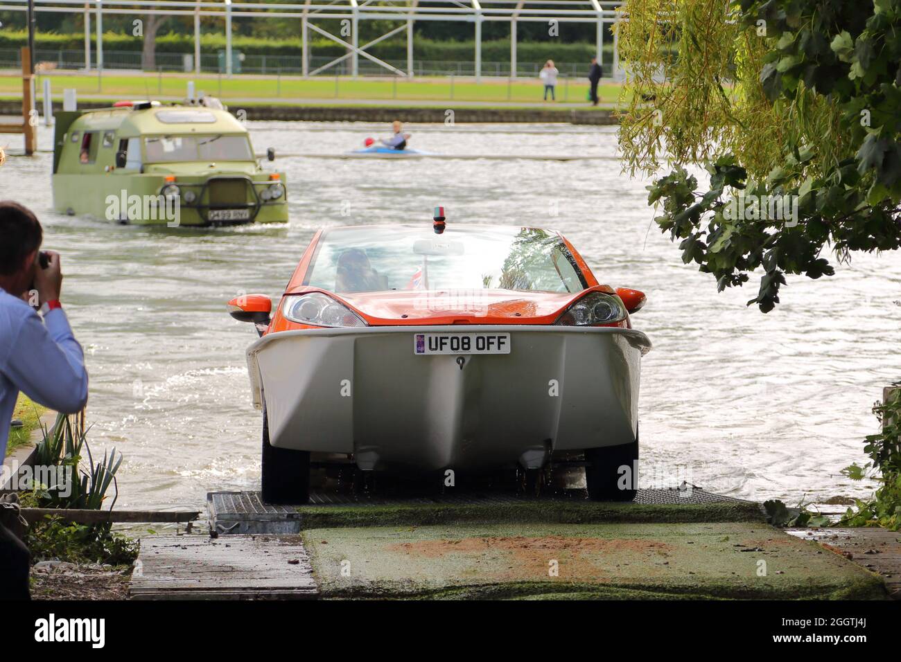 A vintage amphibious Dutton car exiting the river Thames at the ...