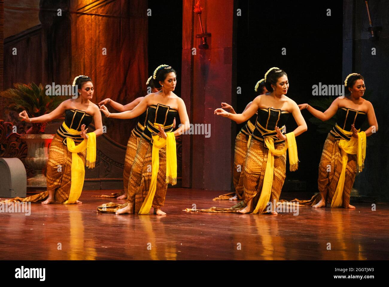 The women are dancing one of the classical Javanese dances. This dance is usually performed for ...