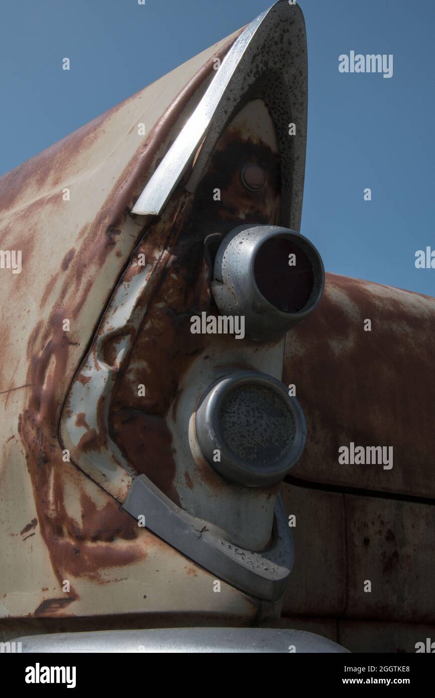 Partial view of the rear and tail lights of an old rusted car Stock ...