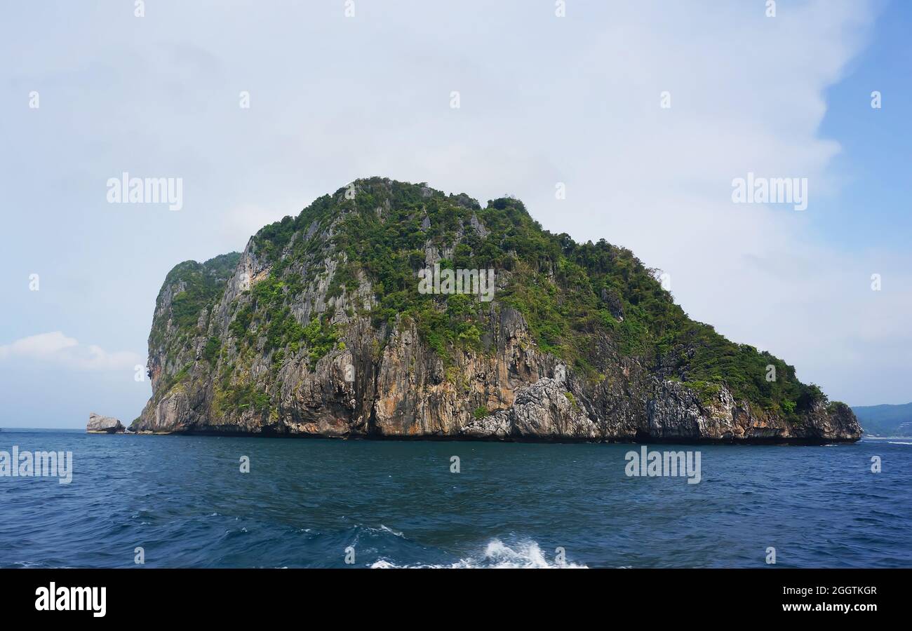 Lone a small rocky island in the middle of the ocean.. Island sea sand ...