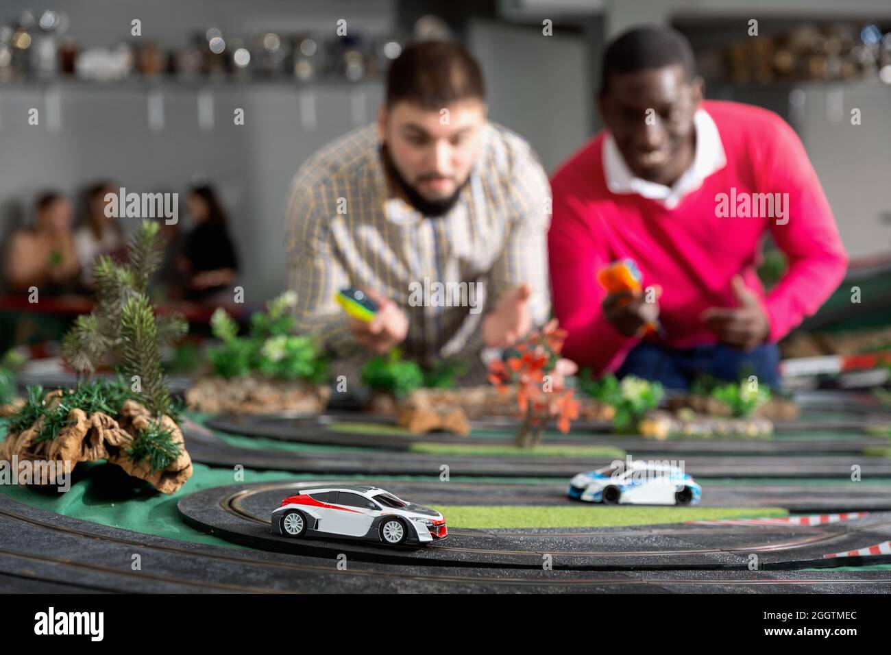 Two people with remote control cars hi-res stock photography and images ...