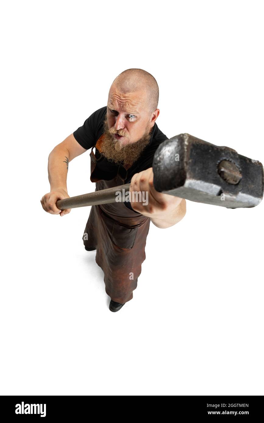 High angle view of bearded bald man, blacksmith wearing leather apron ...