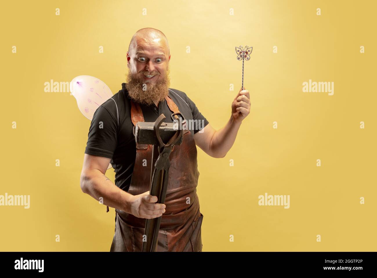 Comic portrait of muscular bearded bald man, blacksmith in leather ...
