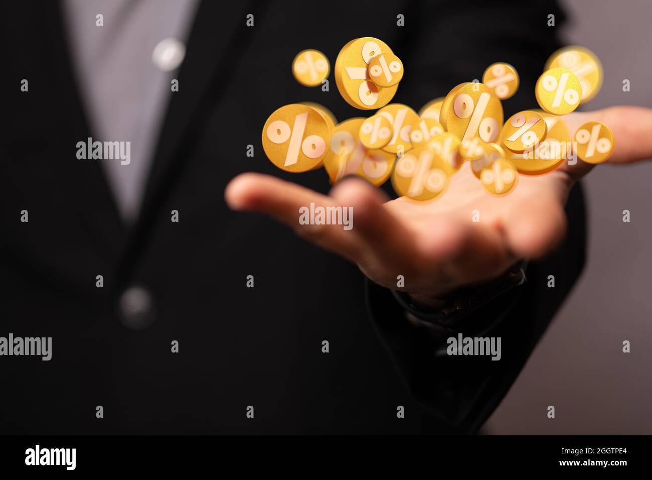 Hand holding 3D percent signs in the air Stock Photo - Alamy