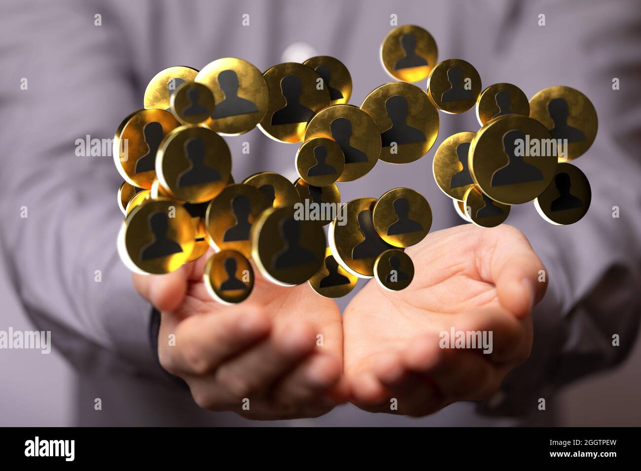 Hand holding person icons - the concept of networking Stock Photo - Alamy