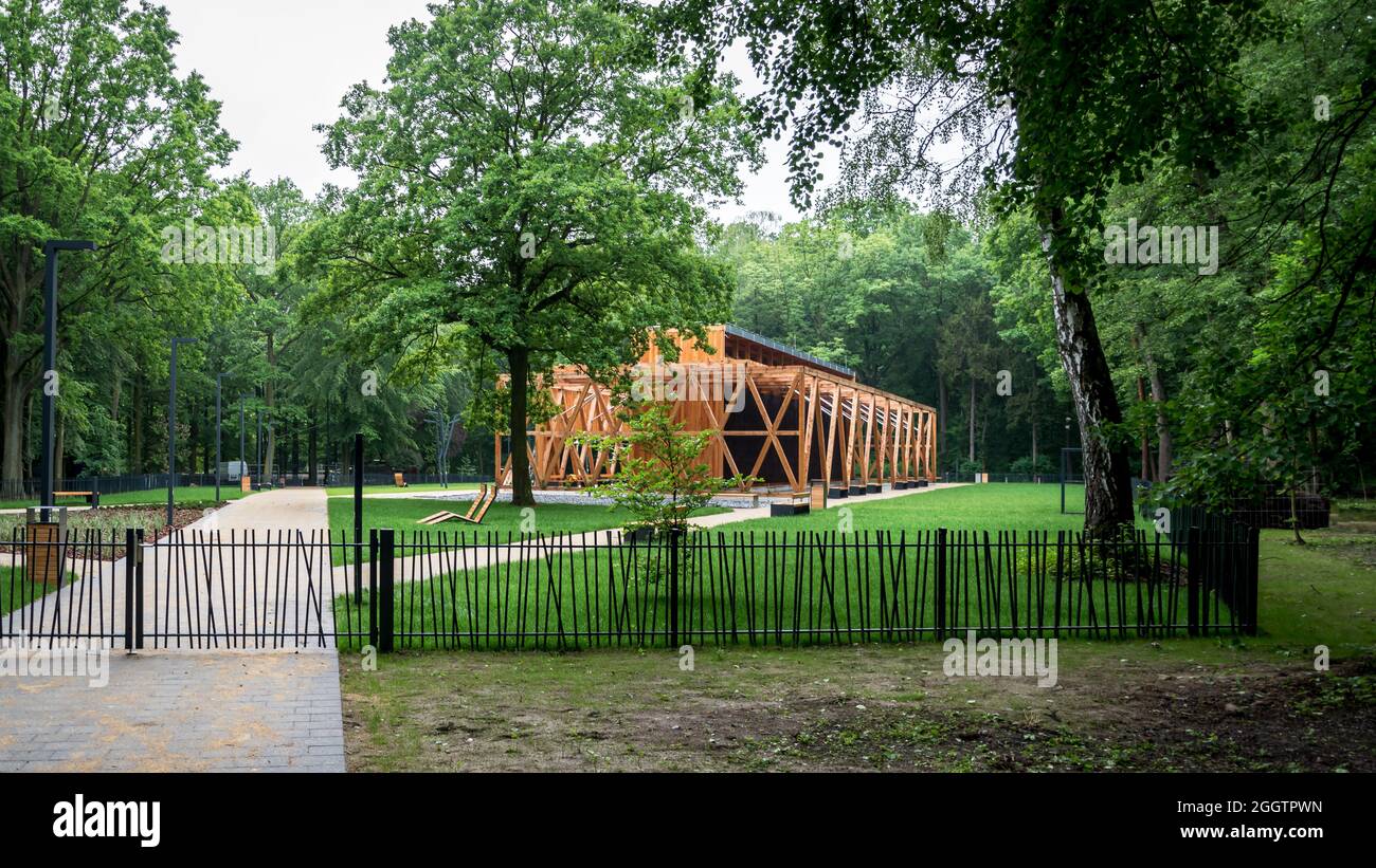 A graduation tower in a city park surrounded by greenery, a place for ...