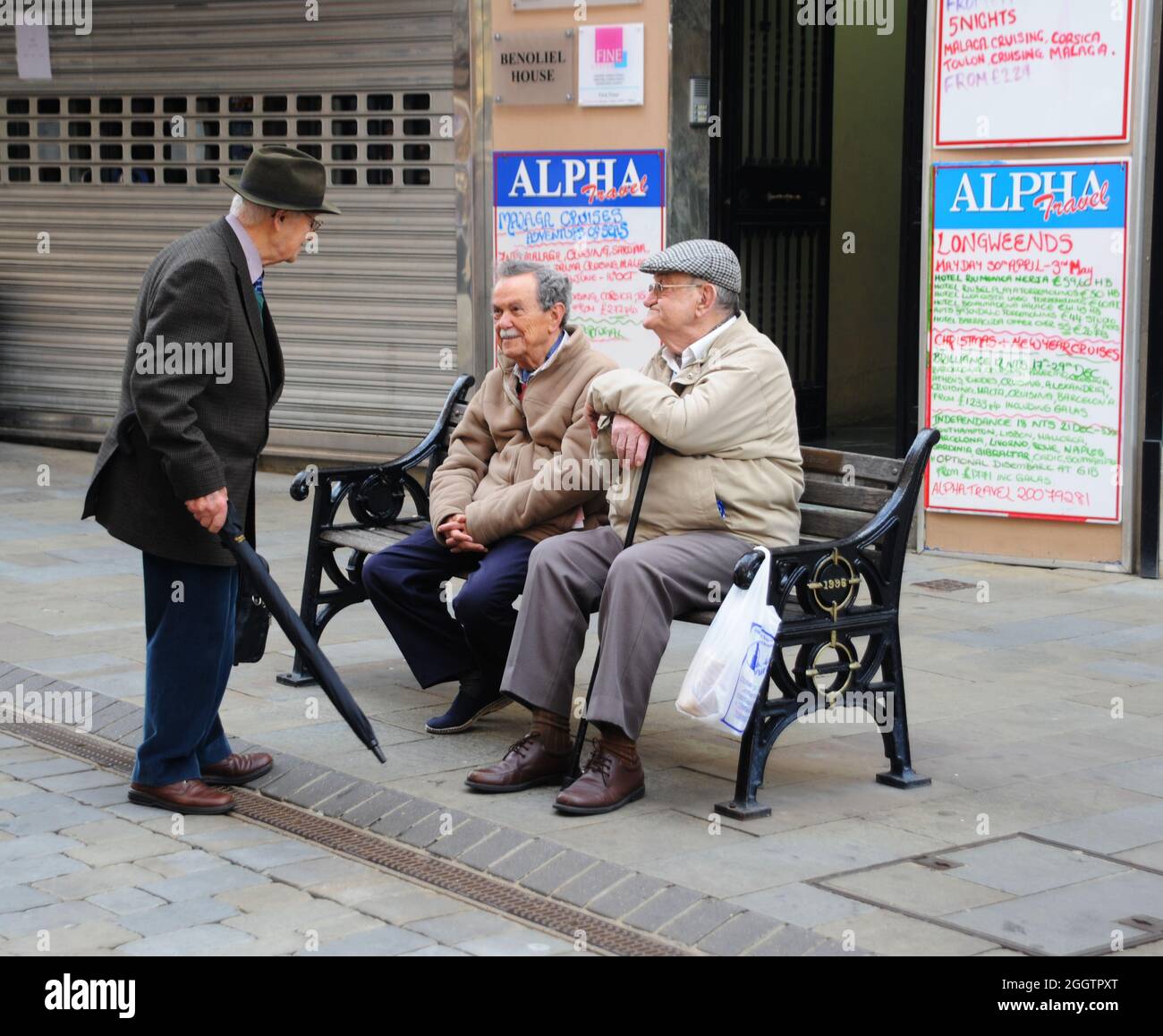Elderly Men Chatting in the Street in Gibraltar Stock Photo - Alamy