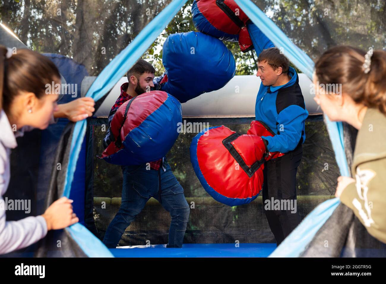 Two men having funny battle Stock Photo - Alamy