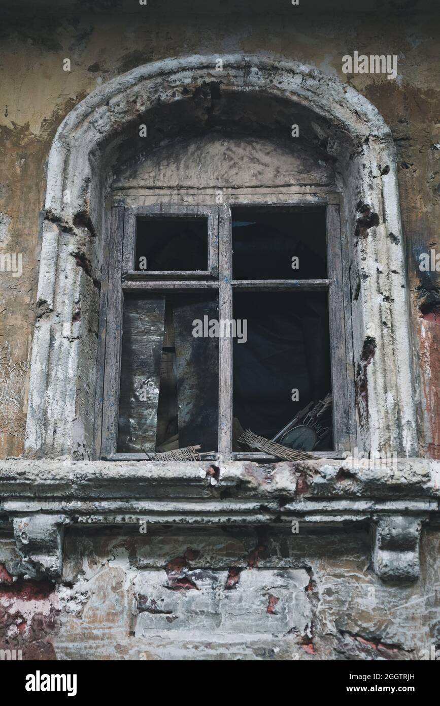 vertical view of broken scary window of abandoned house Stock Photo - Alamy