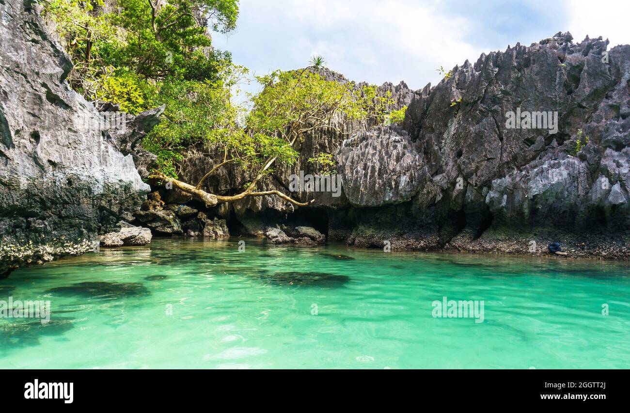 beautiful lagoon with crystal clear turquoise water surrounded by high ...