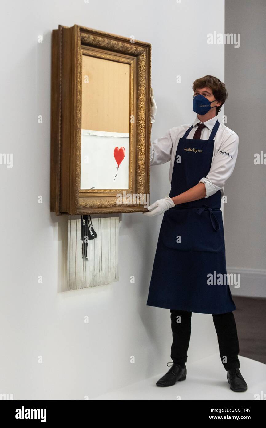Banksy girl with balloon shredded art hi-res stock photography and ...