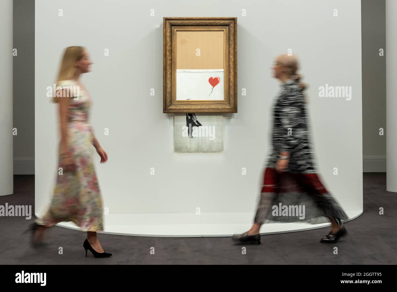 Banksy girl with balloon shredded art hi-res stock photography and ...