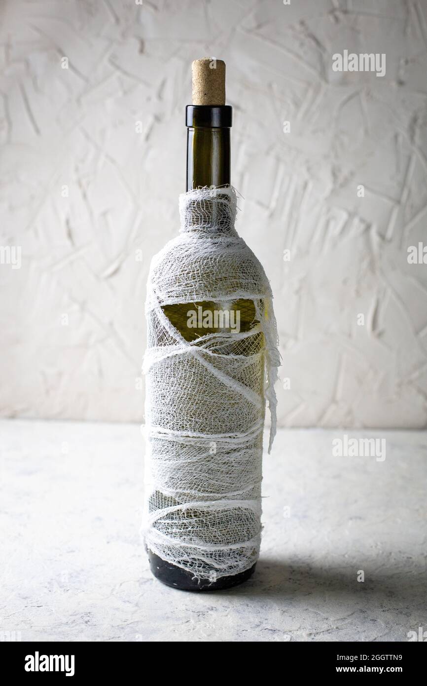 Bottle of cocktail decorated as mummy. Drink for a halloween party for ...