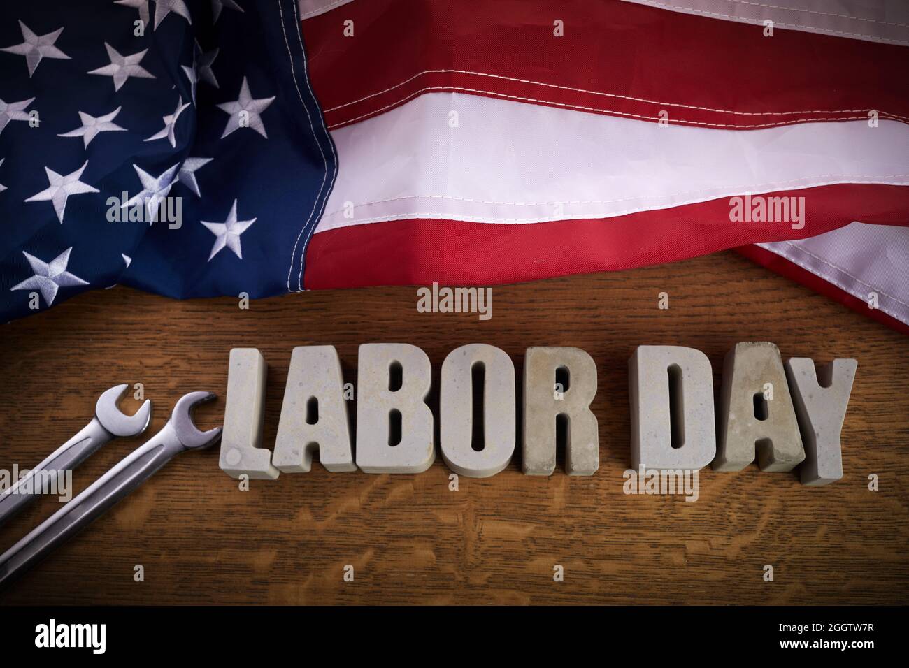 Happy Labor Day banner. USA flag and letters on rustic wooden ...