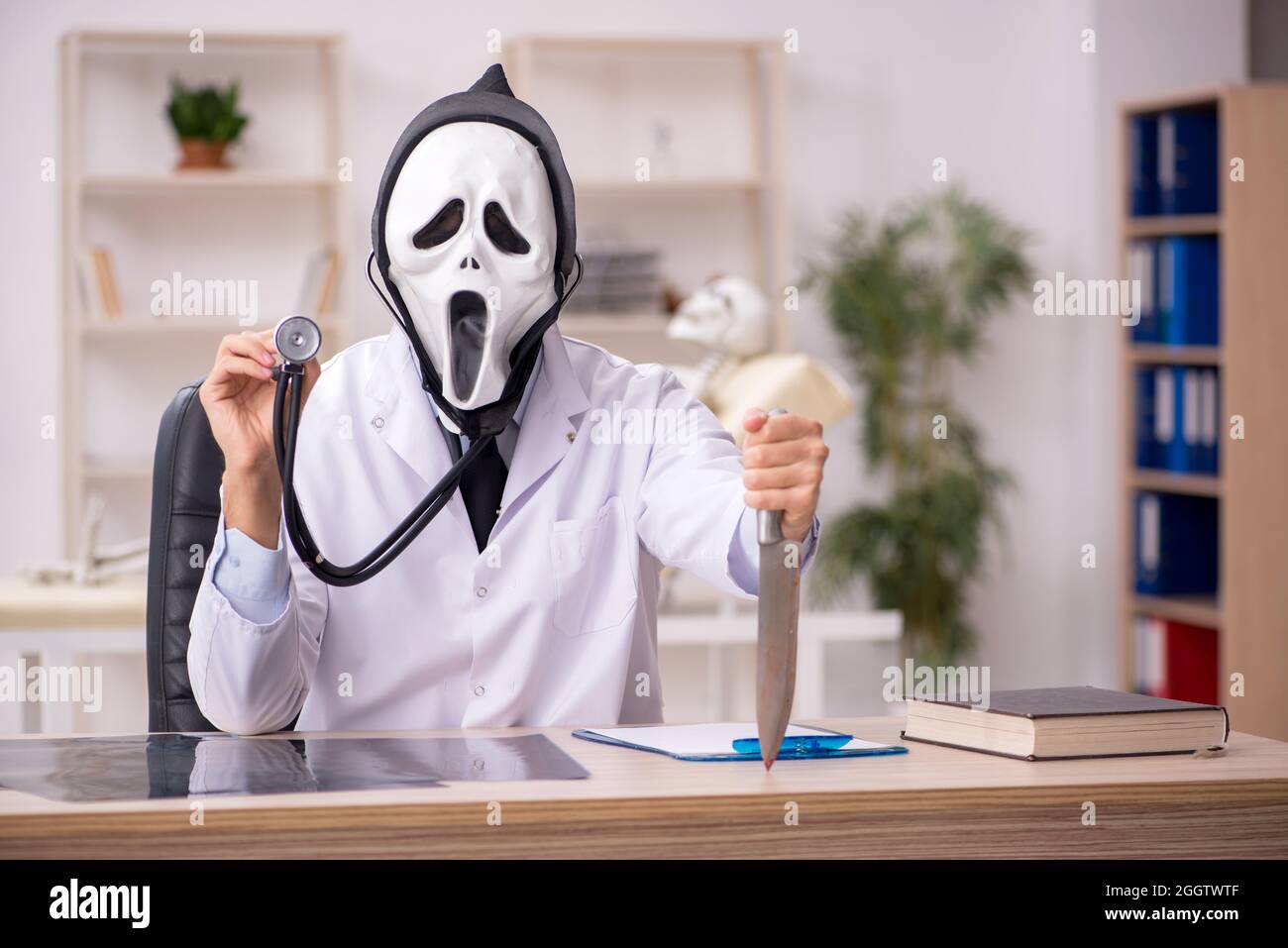 Devil doctor working at the hospital Stock Photo - Alamy