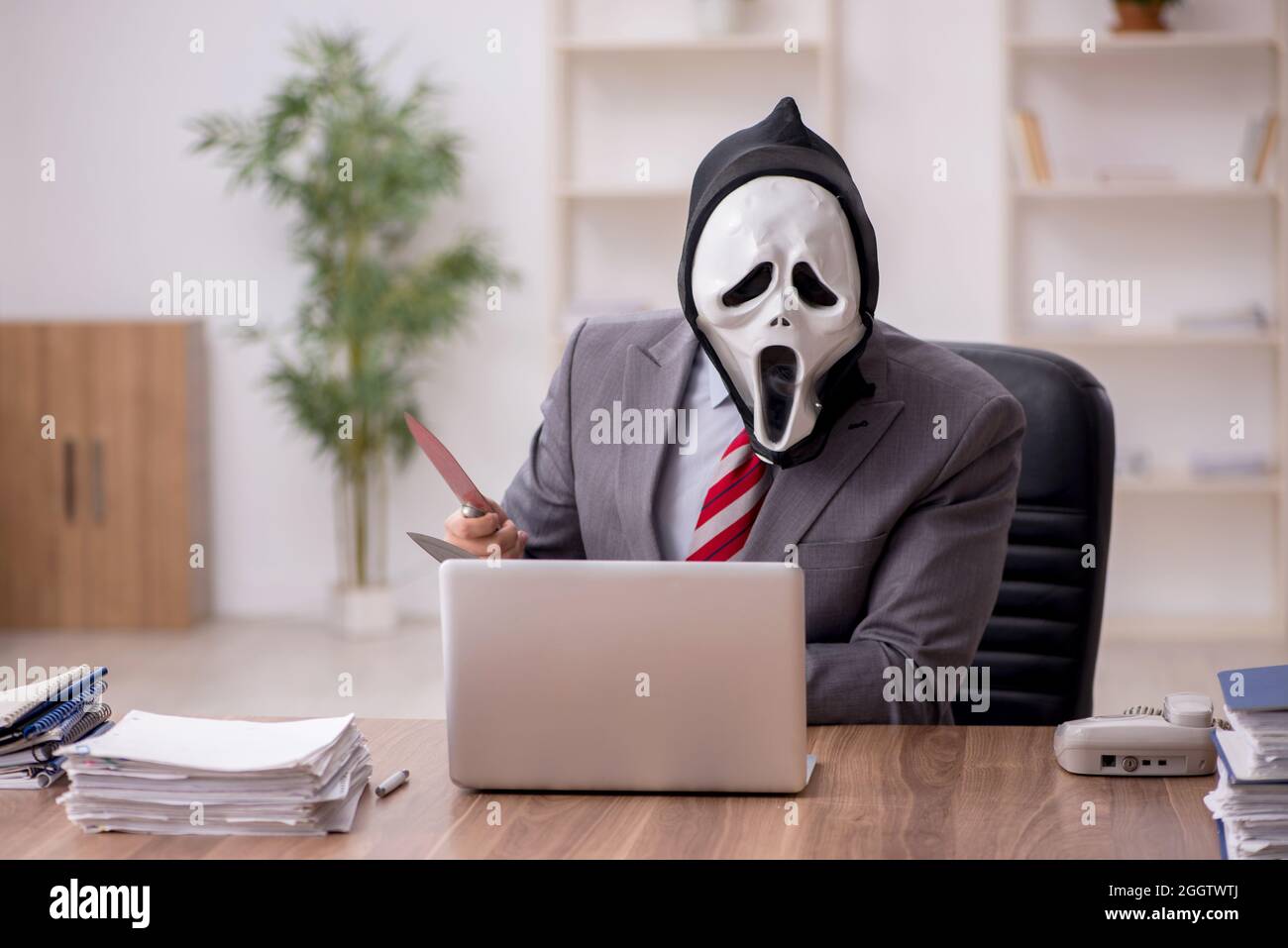 Devil businessman employee working in the office Stock Photo - Alamy