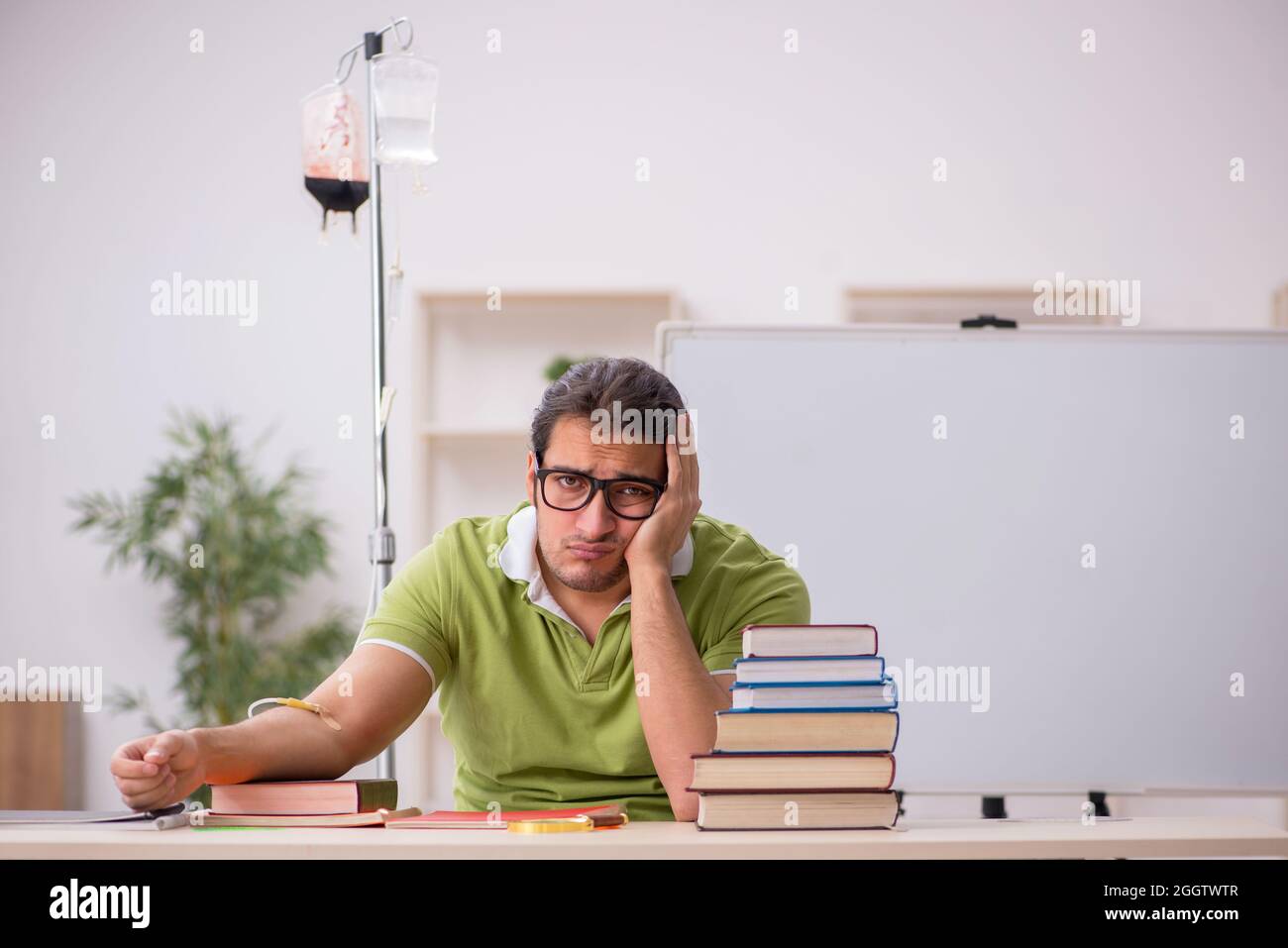 Young sick teacher student in blood transfusion concept Stock Photo - Alamy