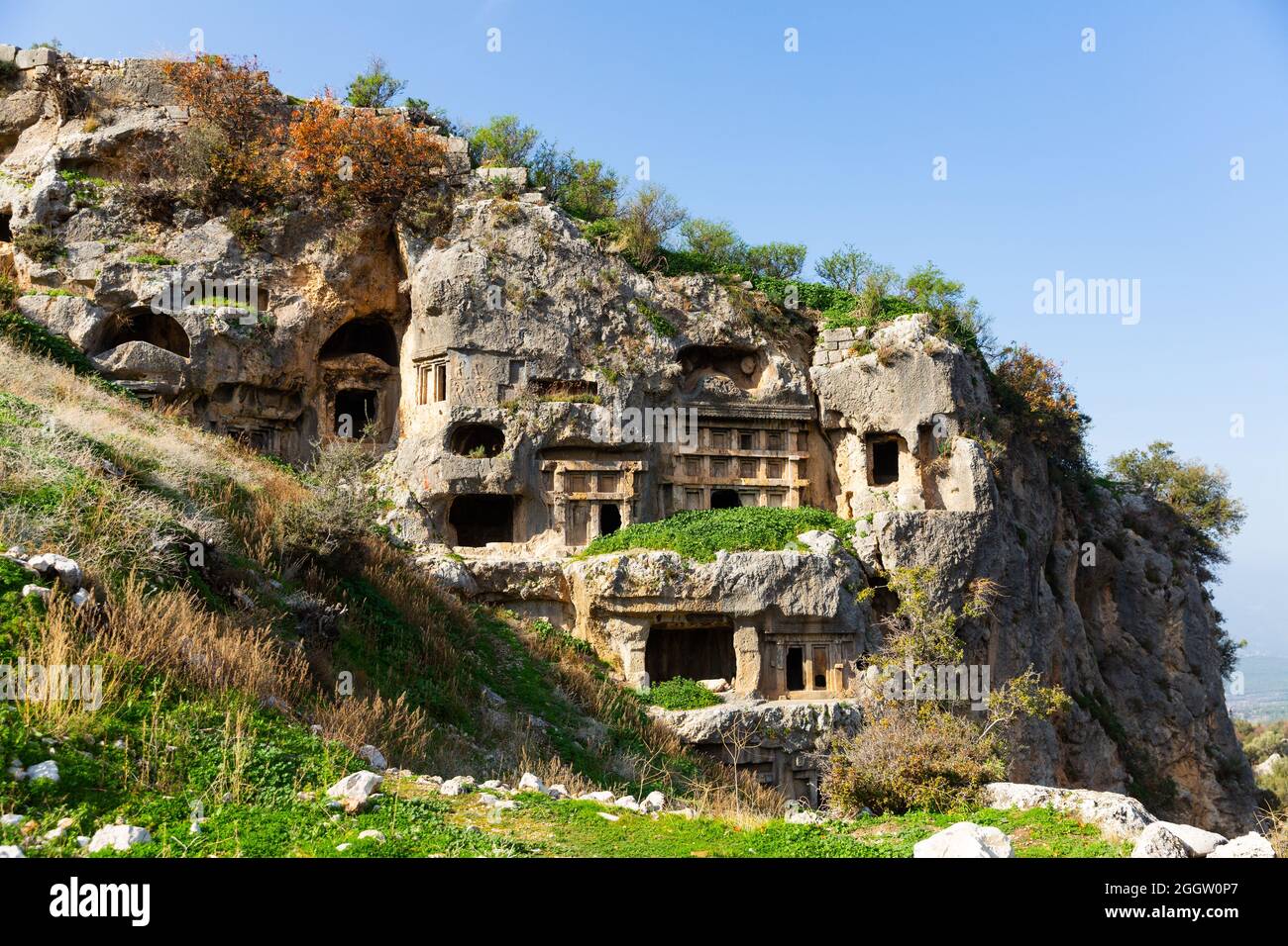 Antique rock burial chambers in ancient Lycian city of Tlos, Turkey ...