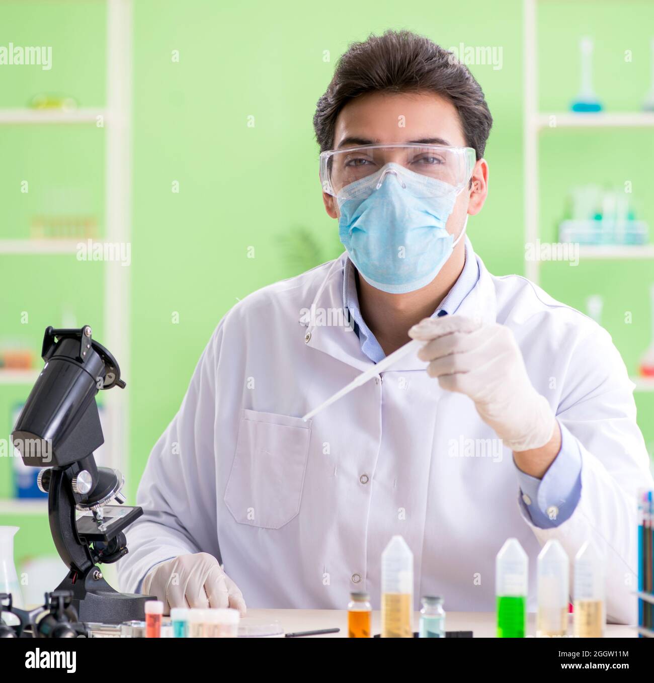 The man chemist working in the lab Stock Photo - Alamy