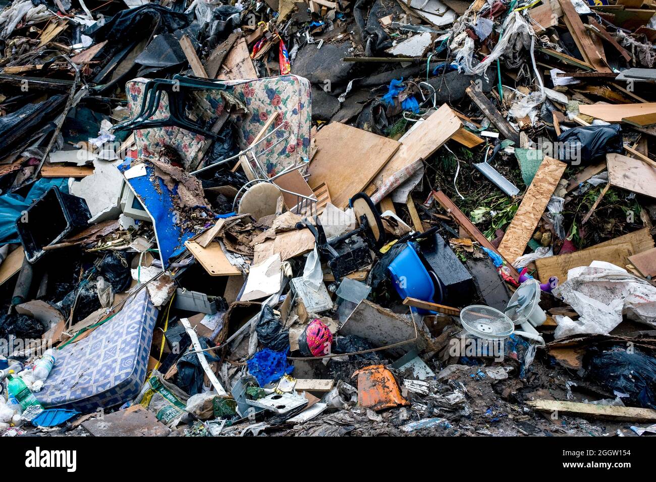 Piles of domestic waste at a materials recycling facility in England ...