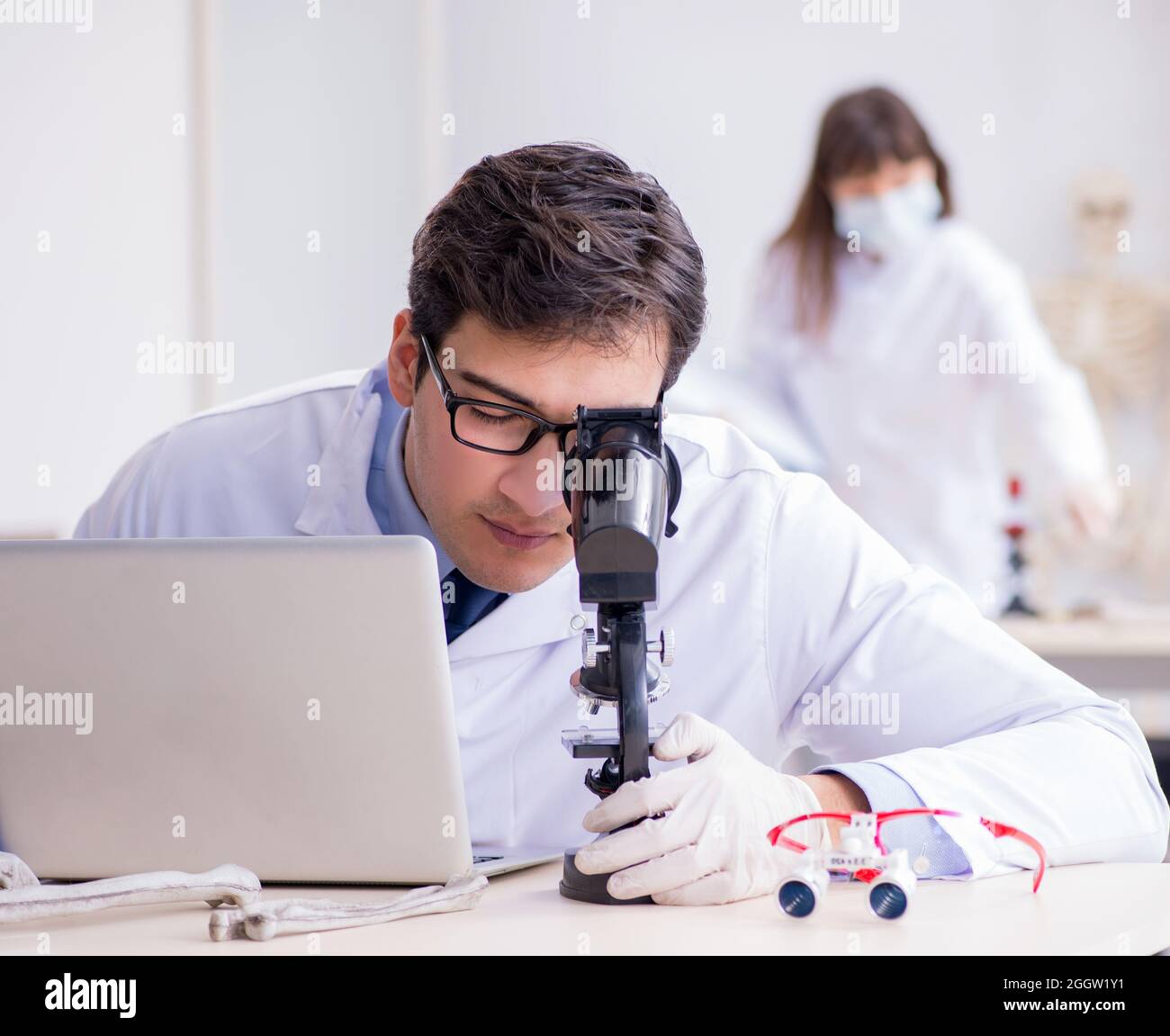 The professor studying human skeleton in lab Stock Photo - Alamy