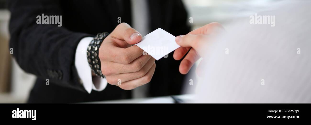 Male hand in suit give blank calling card Stock Photo - Alamy