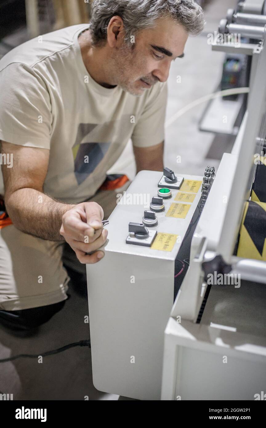Close up of electrician engineer works with electric cable wires ...