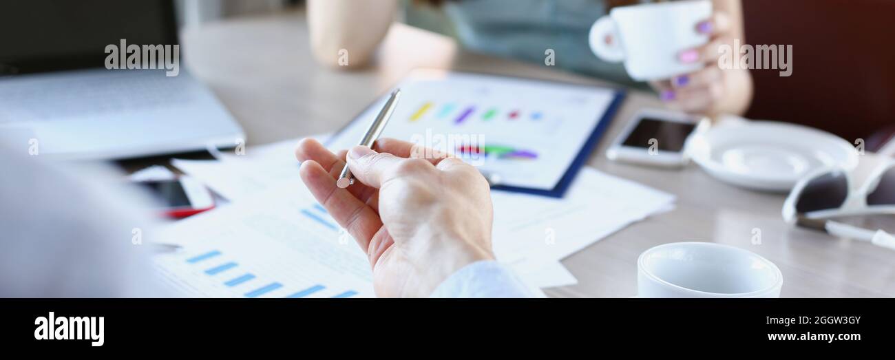 Group of people discuss plan at workplace closeup Stock Photo - Alamy