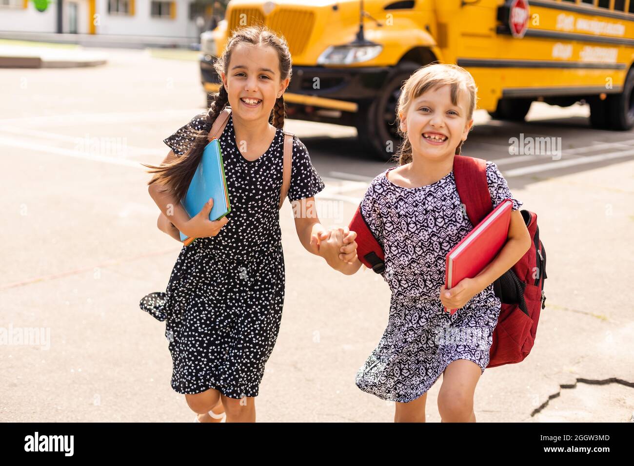 Lucky to meet each other. Cheerful smart schoolgirls. Happy schoolgirls ...