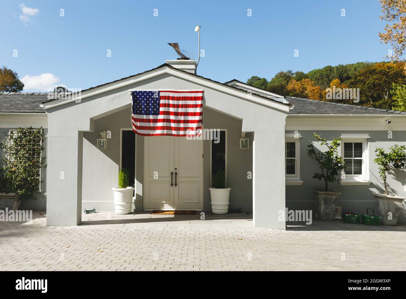 House decorated with american flag with landscape and blue sky with ...