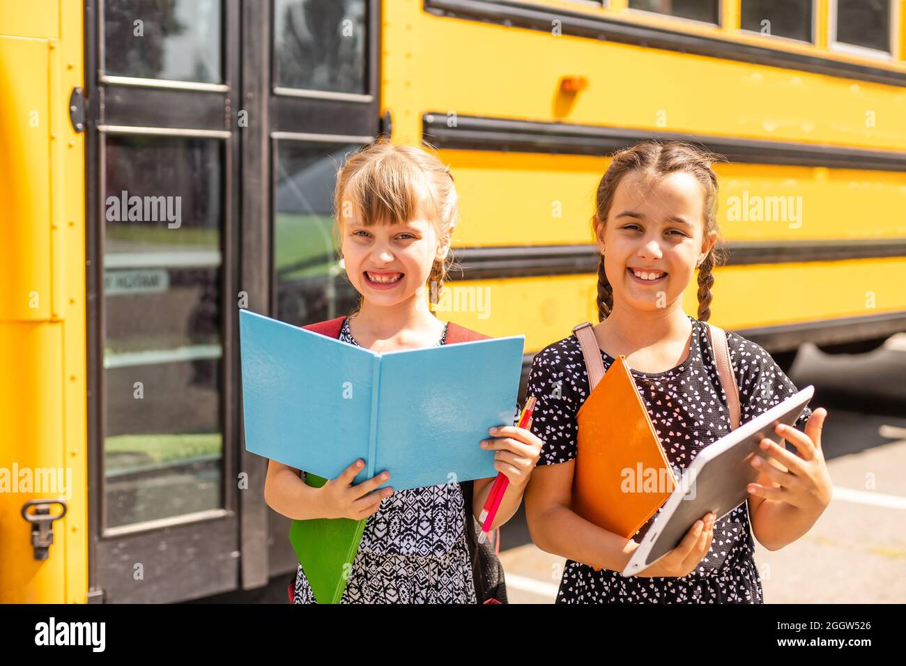 Basic school students crossing the road Stock Photo - Alamy