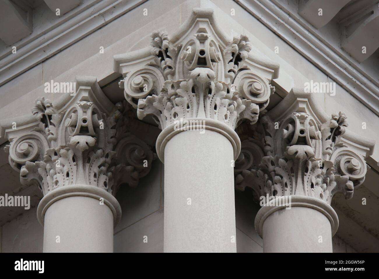 Three white stone columns standing in the bright summer sun Stock Photo ...