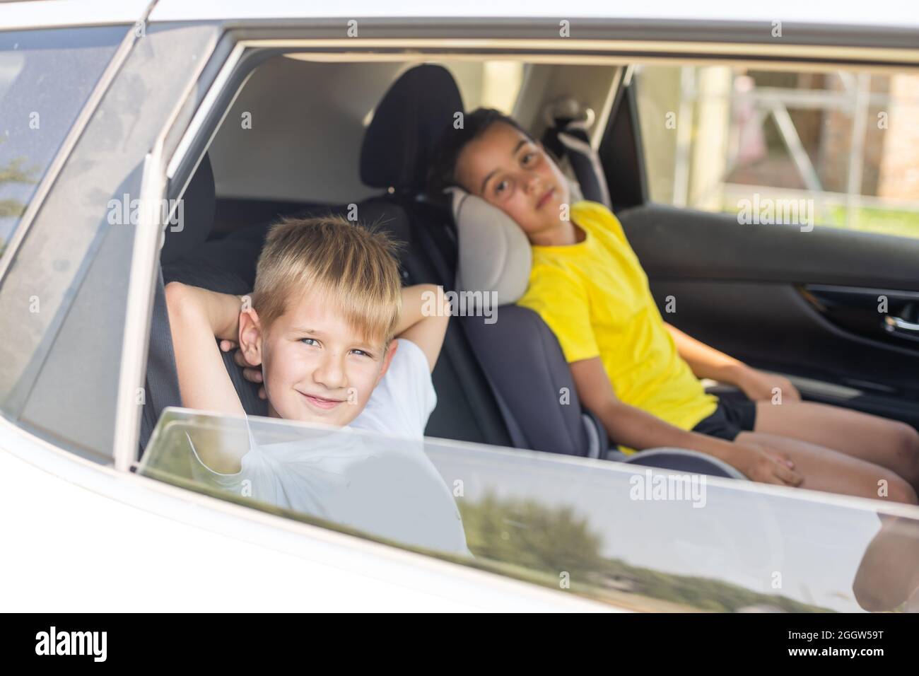 Cute children in car, boy and girl in the car Stock Photo - Alamy
