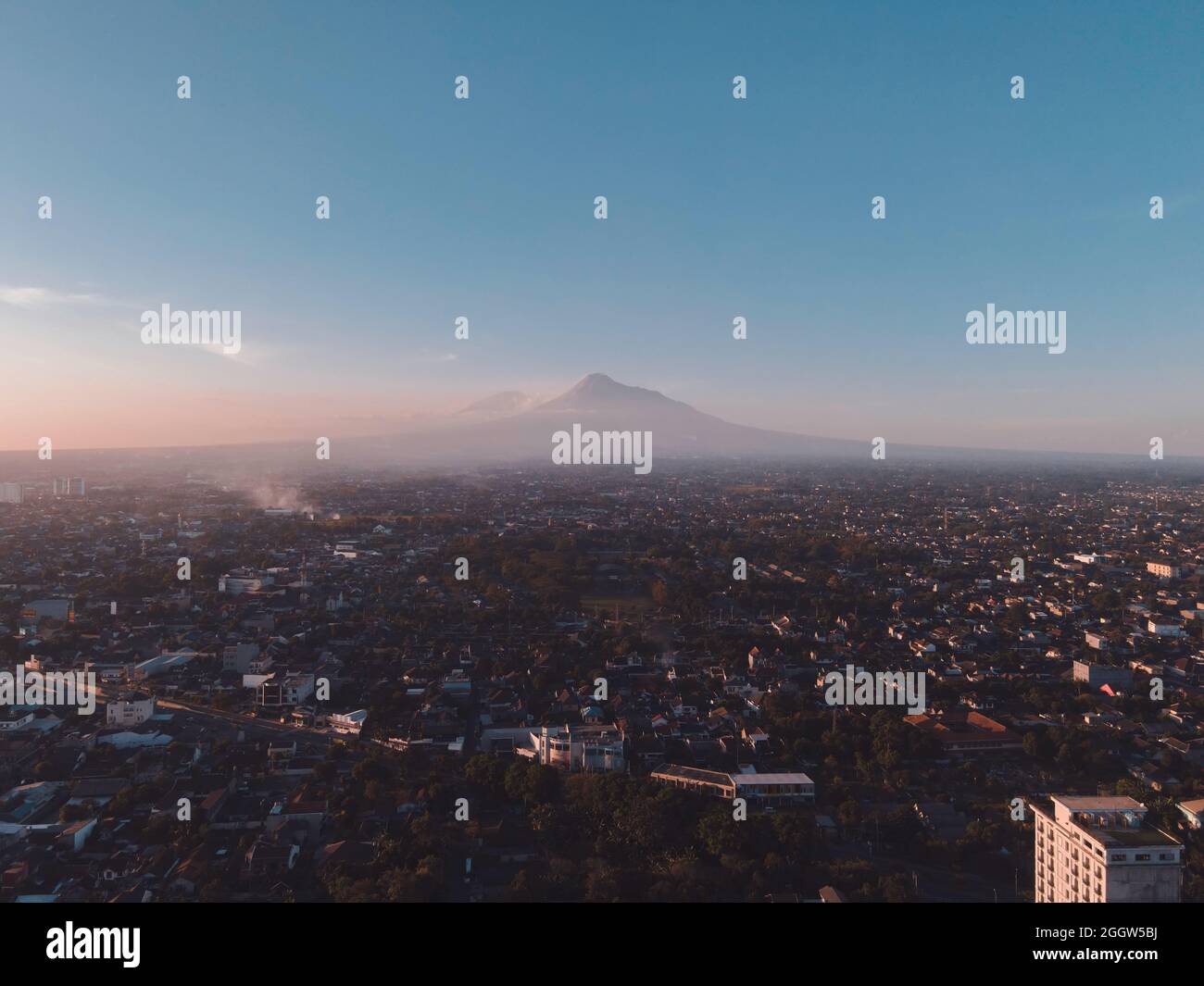 Aerial view of sunset Mount Merapi and Yogyakarta city, Indonesia. City ...