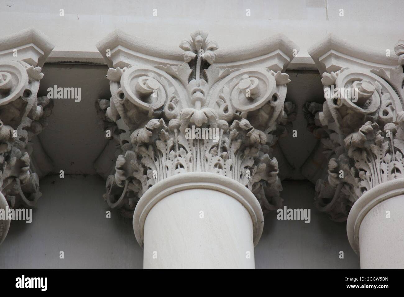 White Romanesque columns with elaborate decorations Stock Photo - Alamy