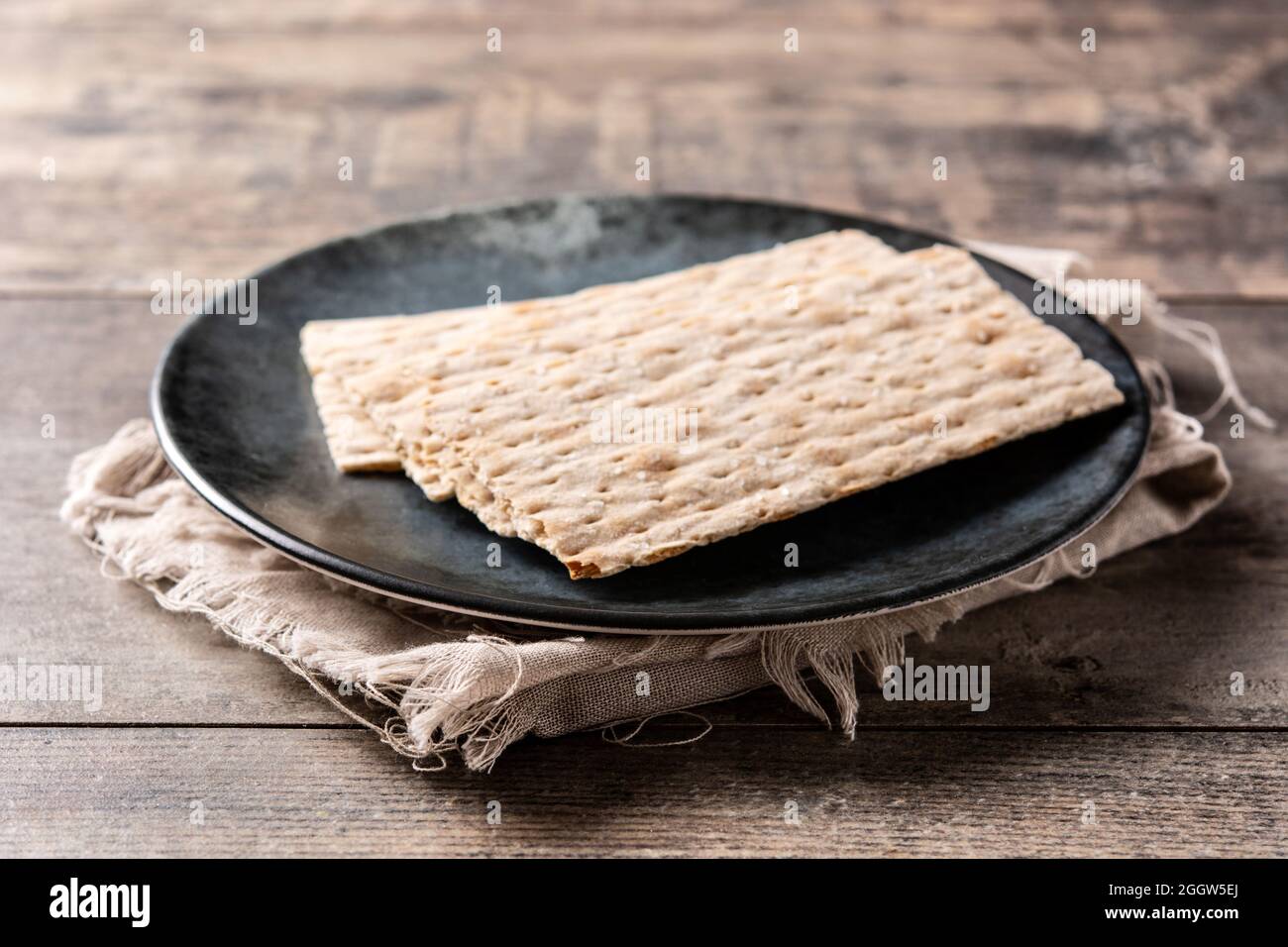 Traditional matzah bread on rustic wooden table Stock Photo - Alamy