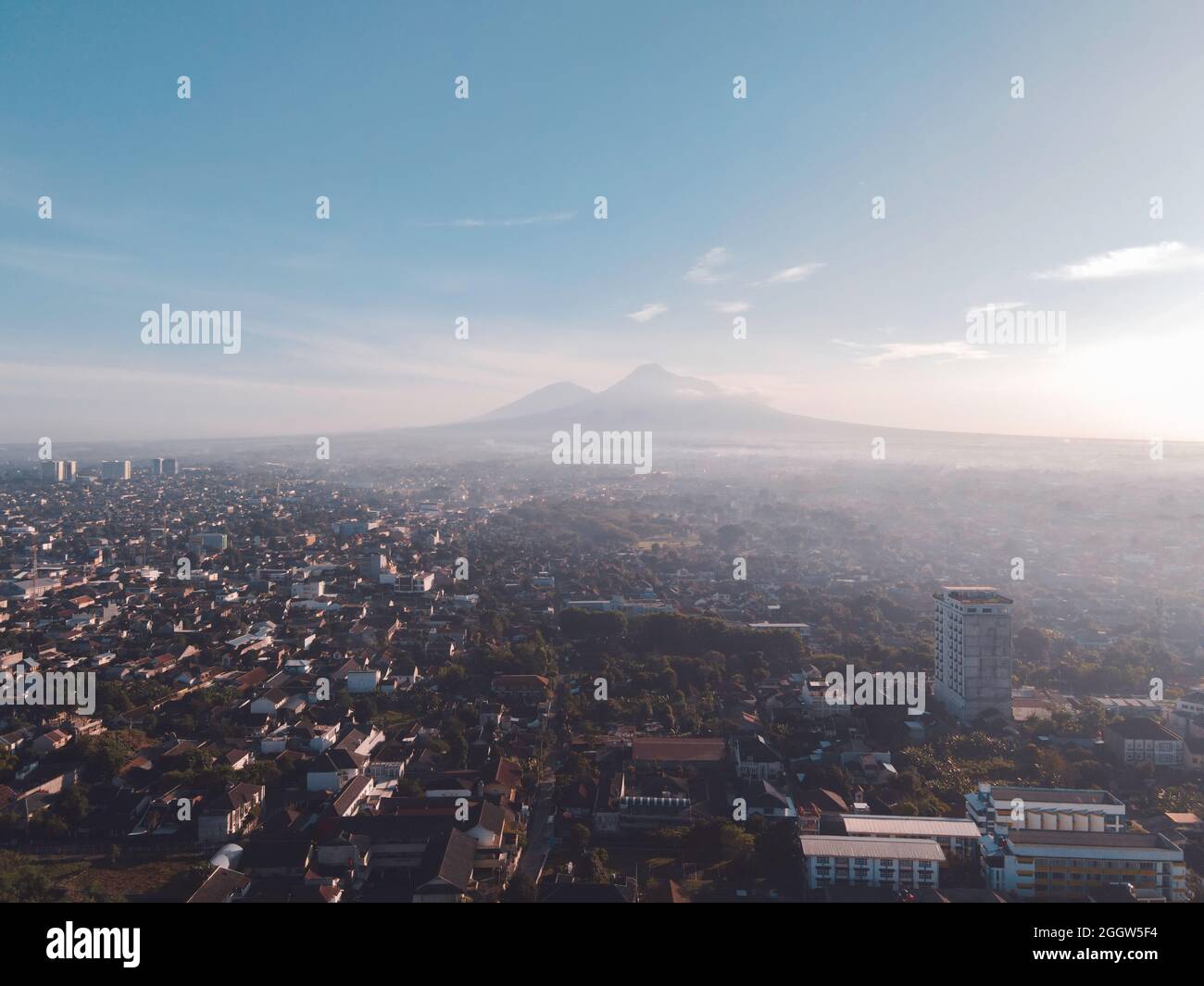 Aerial view of sunset Mount Merapi and Yogyakarta city, Indonesia. City ...