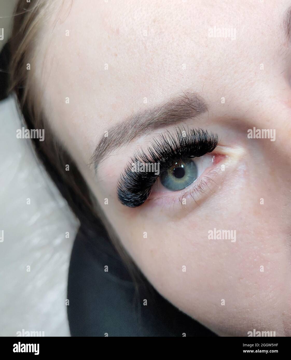 Lash extensions in beauty salon macro eye top view Stock Photo - Alamy