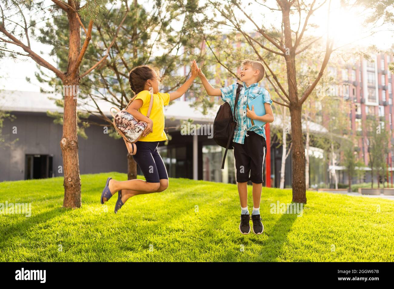 Elementary school kids having fun outdoors Stock Photo - Alamy
