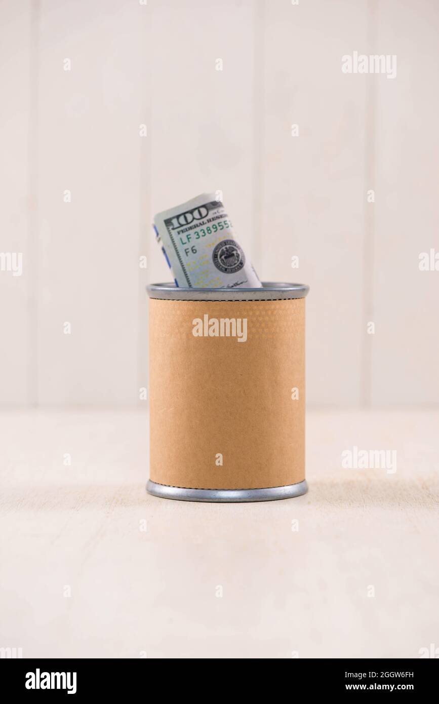 Putting money into donation box. Donate concept Stock Photo - Alamy