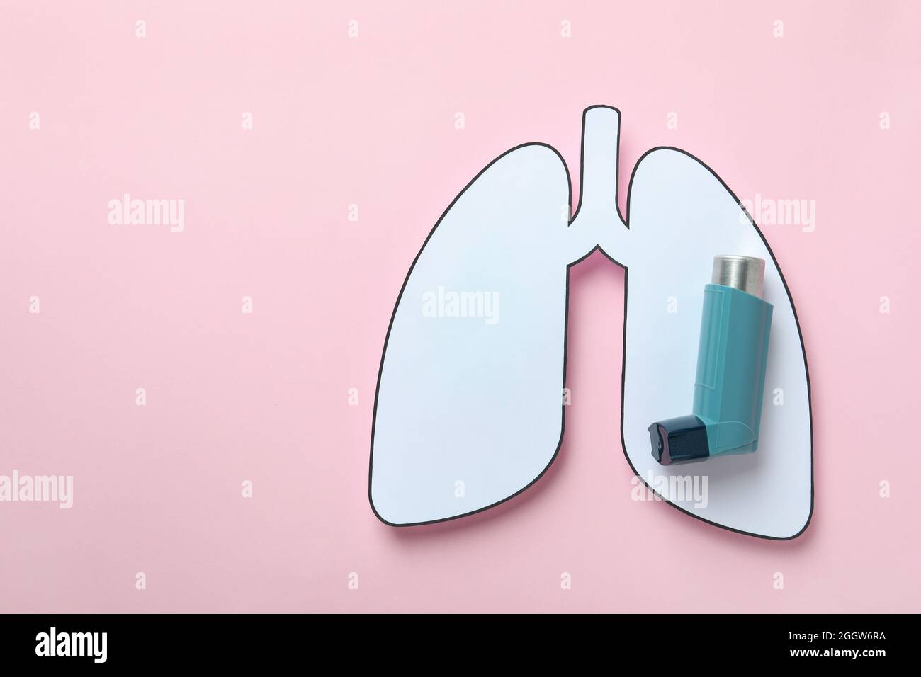 Decorative lungs and inhaler on pink background Stock Photo - Alamy
