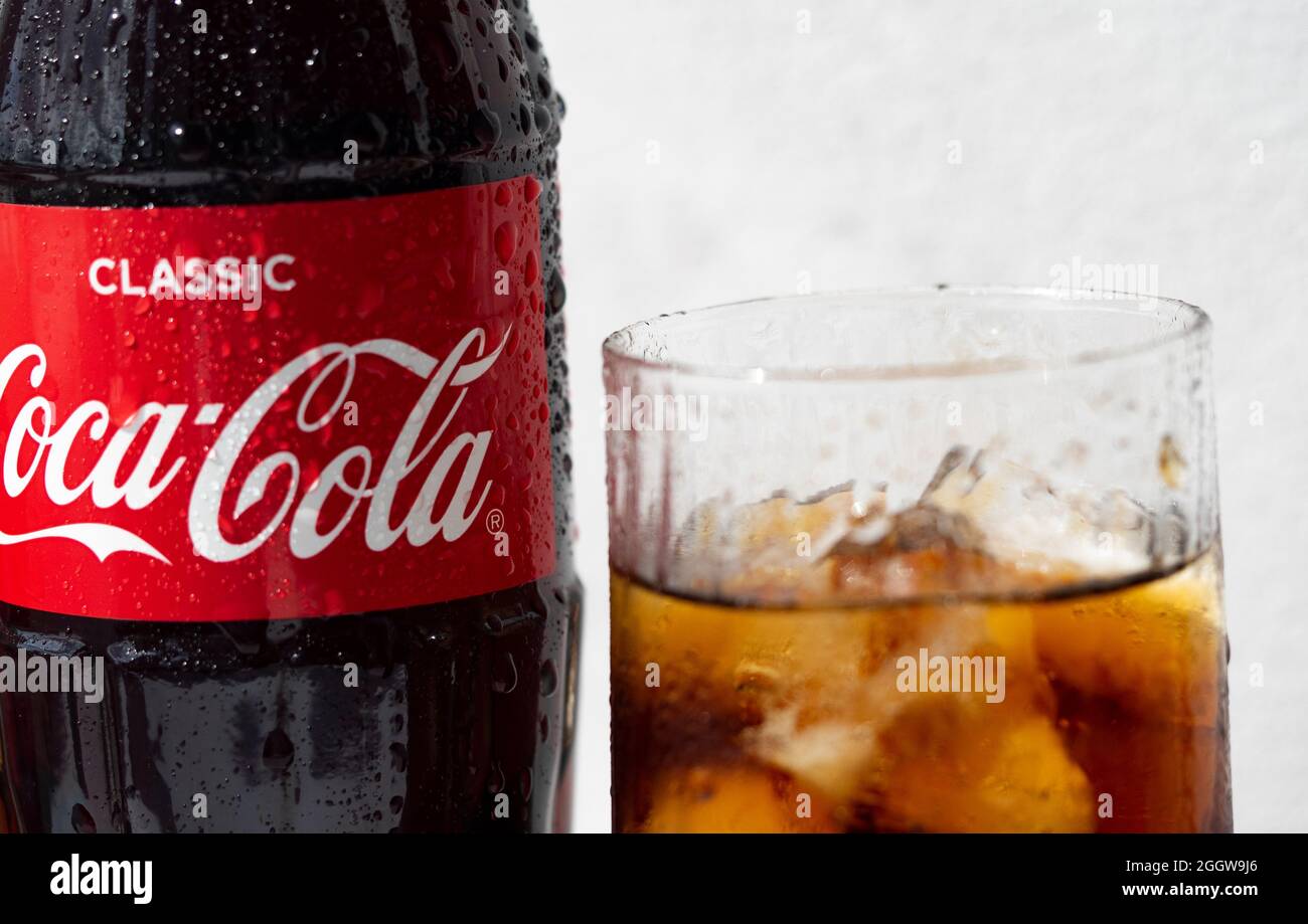 Close-up of bottle and glass of Coca Cola on a white background Stock ...