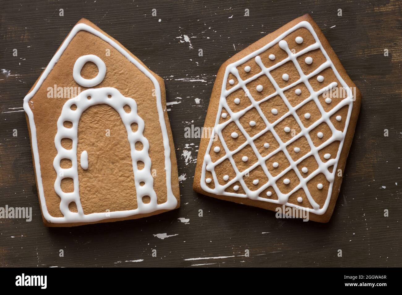 Top view of decorated by frosting walls of gingerbread house on wooden ...