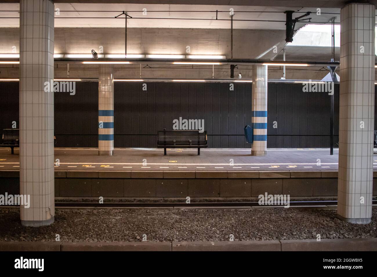 An empty bench on one of the platforms of Station Rijswijk (South ...