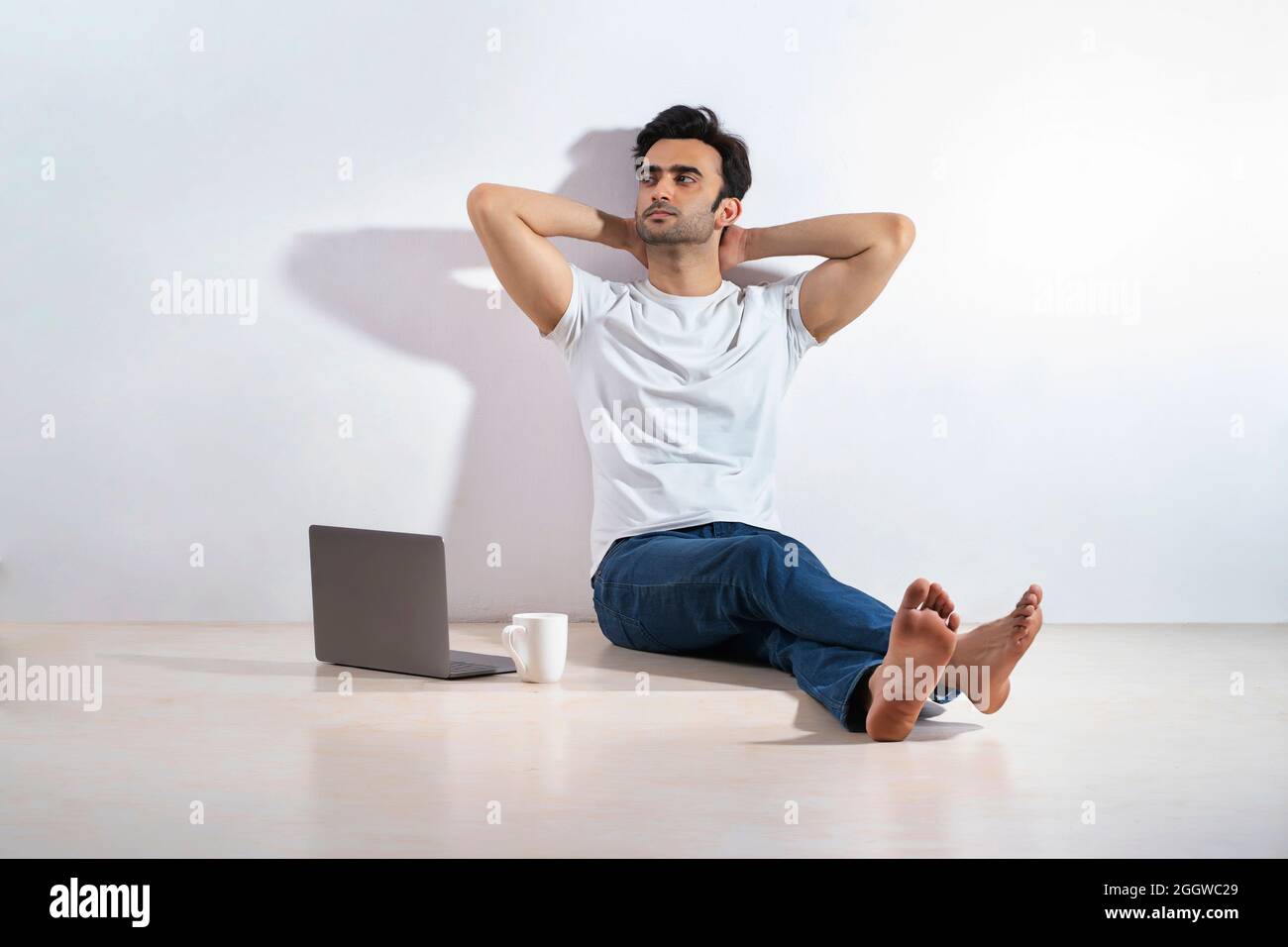 Muscular man sitting on floor hi-res stock photography and images - Alamy