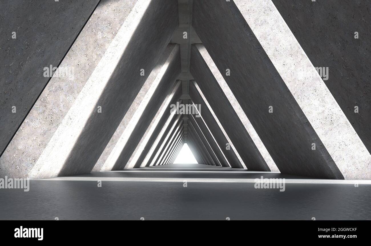 A look down a concrete tunnel made of triangular geometric shapes with ...