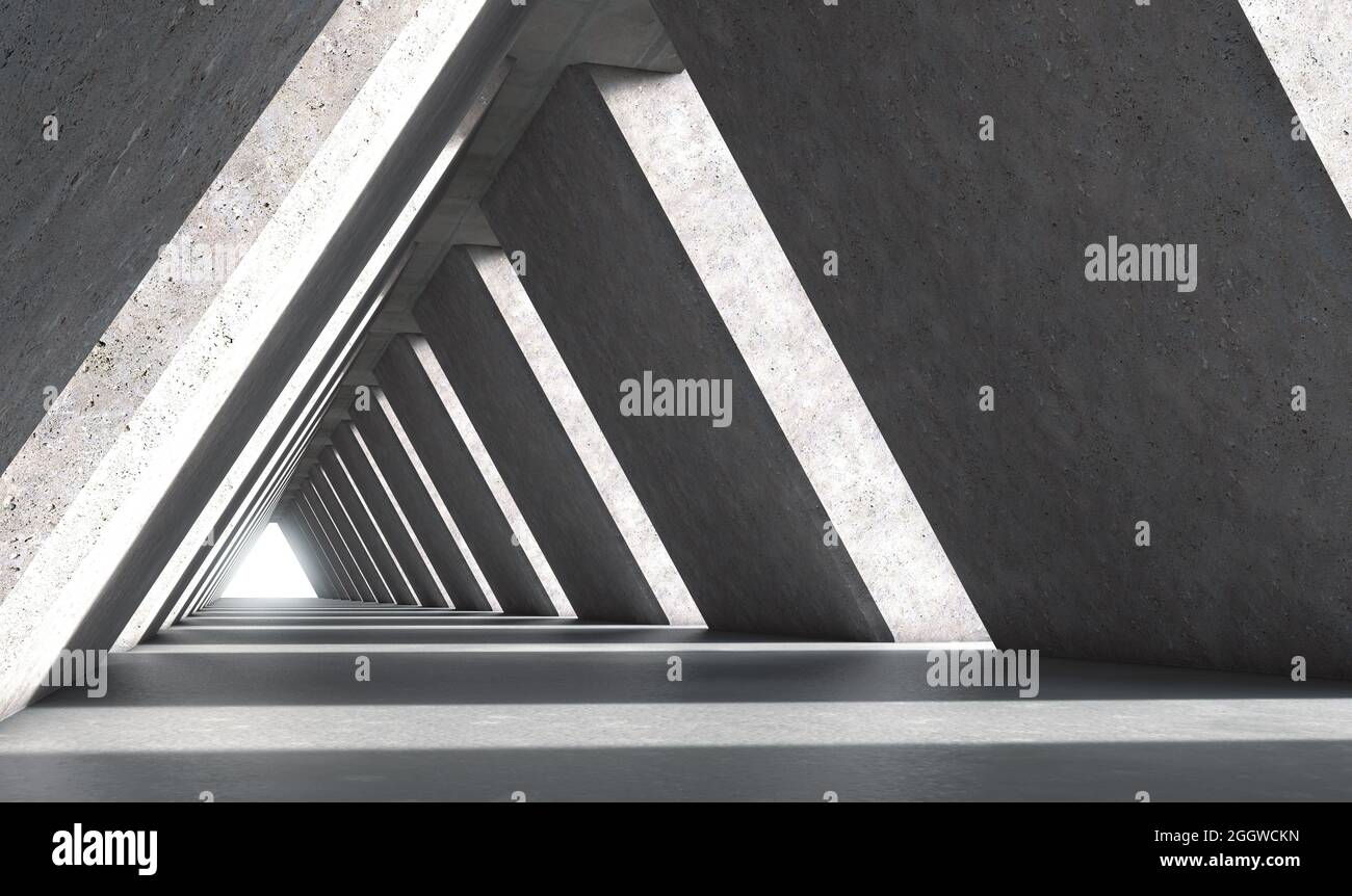 A look down a concrete tunnel made of triangular geometric shapes with ...