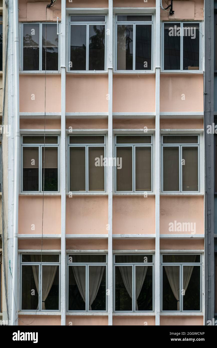 Closeup of uniform glass windows of a building in Singapore Stock Photo ...