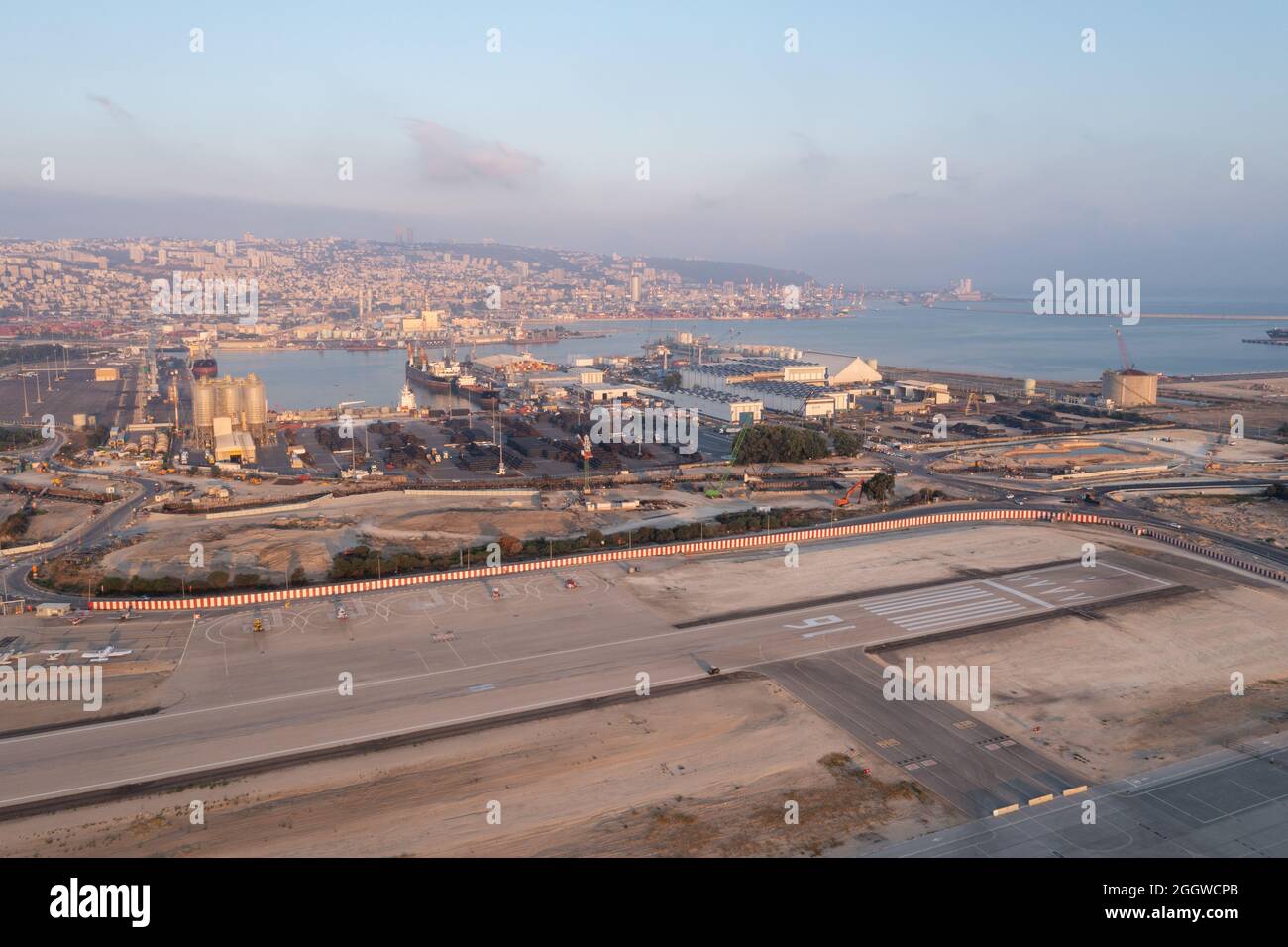 Haifa airport and runway with the city skyline in the background ...