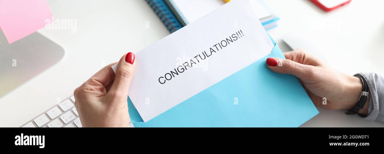 Female hands holding envelope with congratulations closeup Stock Photo ...
